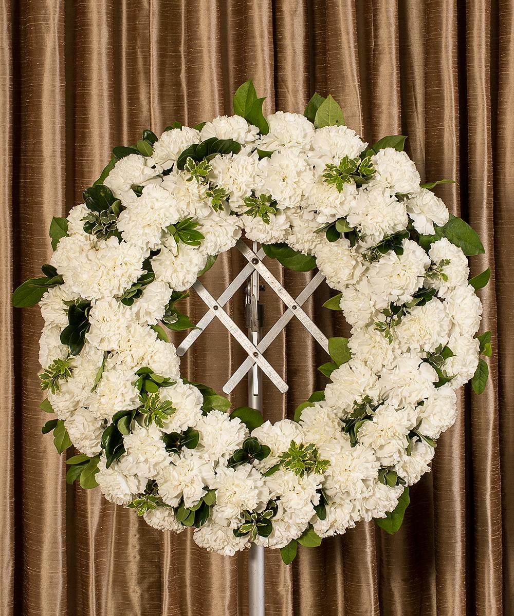White Carnation Wreath - Same-day delivery Danvers (MA) Currans Flowers